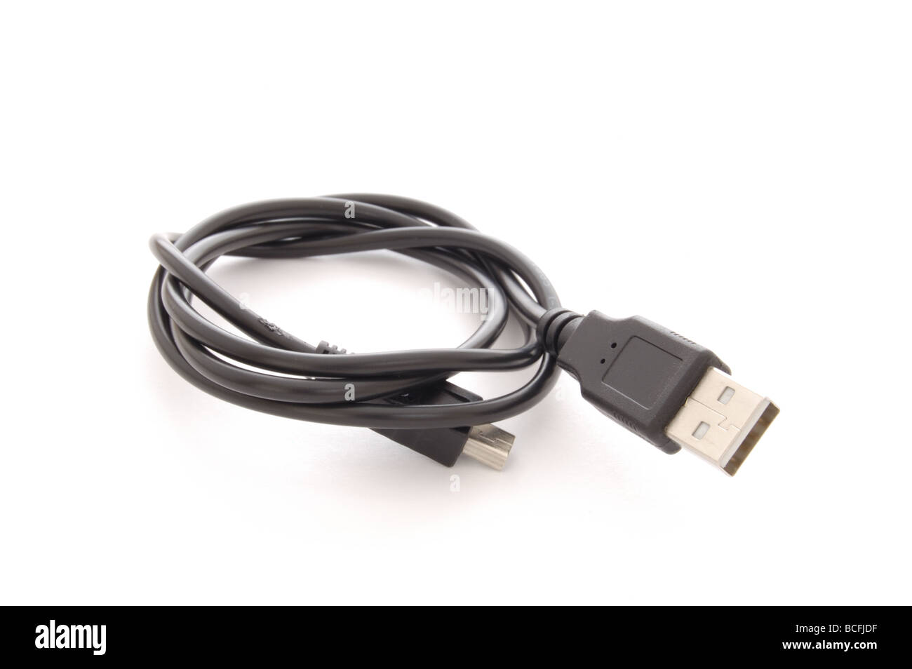 Coiled USB download cable on white background Stock Photo - Alamy