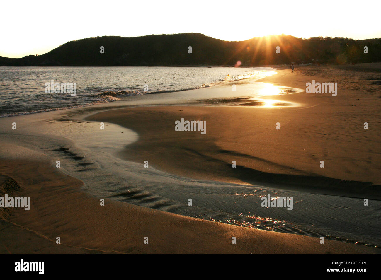 Ocean beach sunset in Cut Out Stock Images & Pictures - Alamy