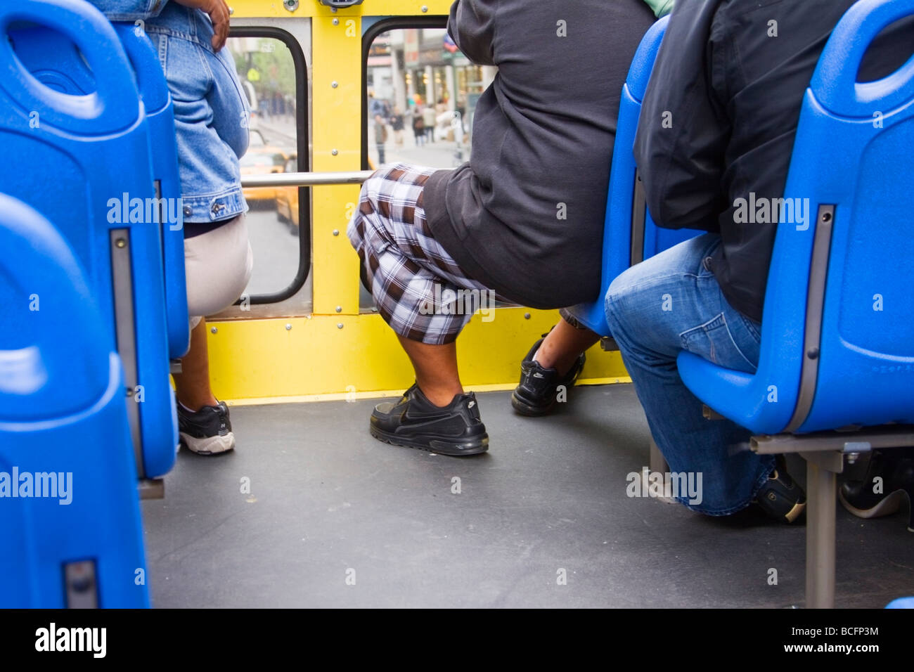 Obese passenger on a tour bus, New York, USA Stock Photo - Alamy