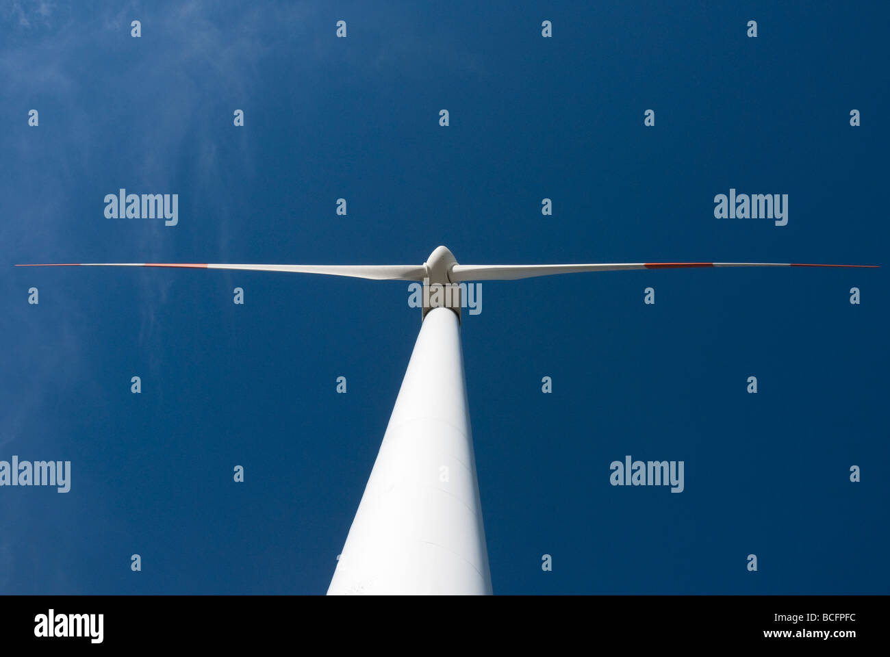 Looking up at wind turbine, and blue sky Stock Photo - Alamy