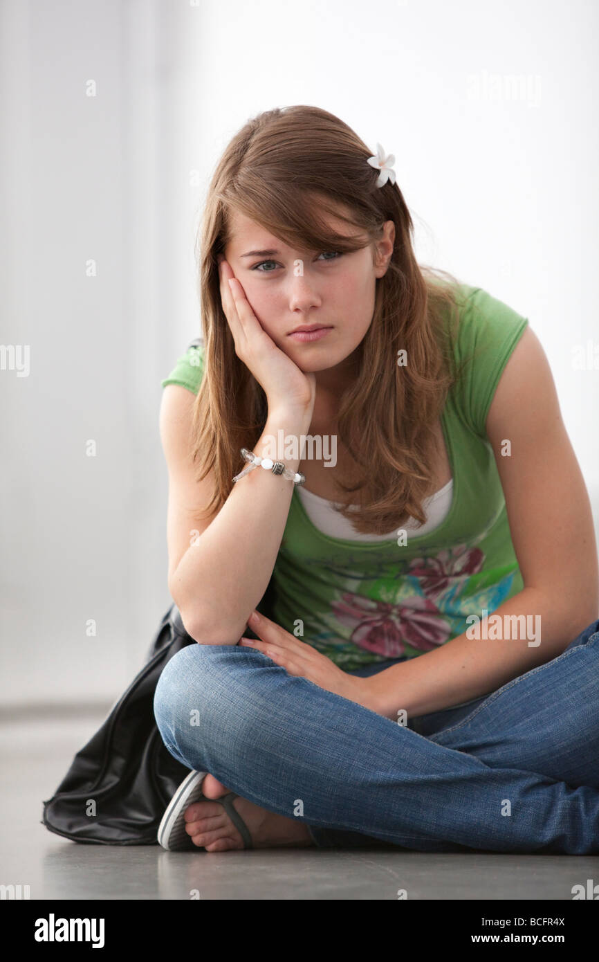 Portrait of a teenage girl in a bad mood Stock Photo - Alamy