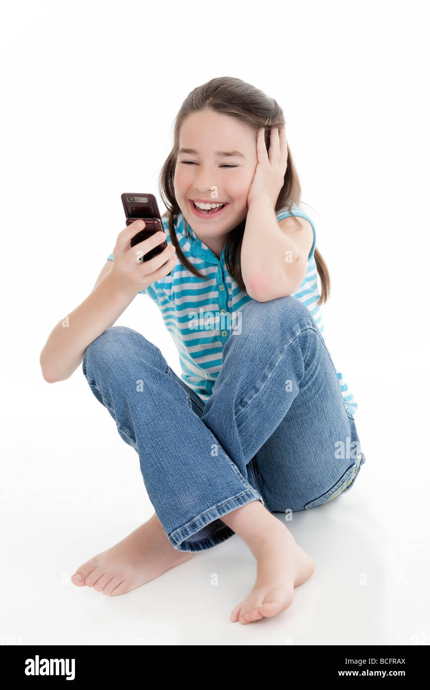 Cute Caucasian girls texting on a cell phone Stock Photo - Alamy
