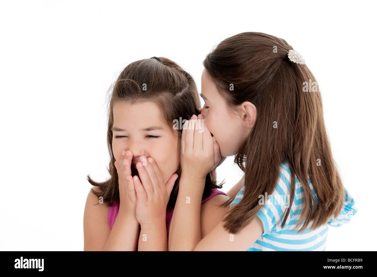 Children telling secrets hi-res stock photography and images - Alamy