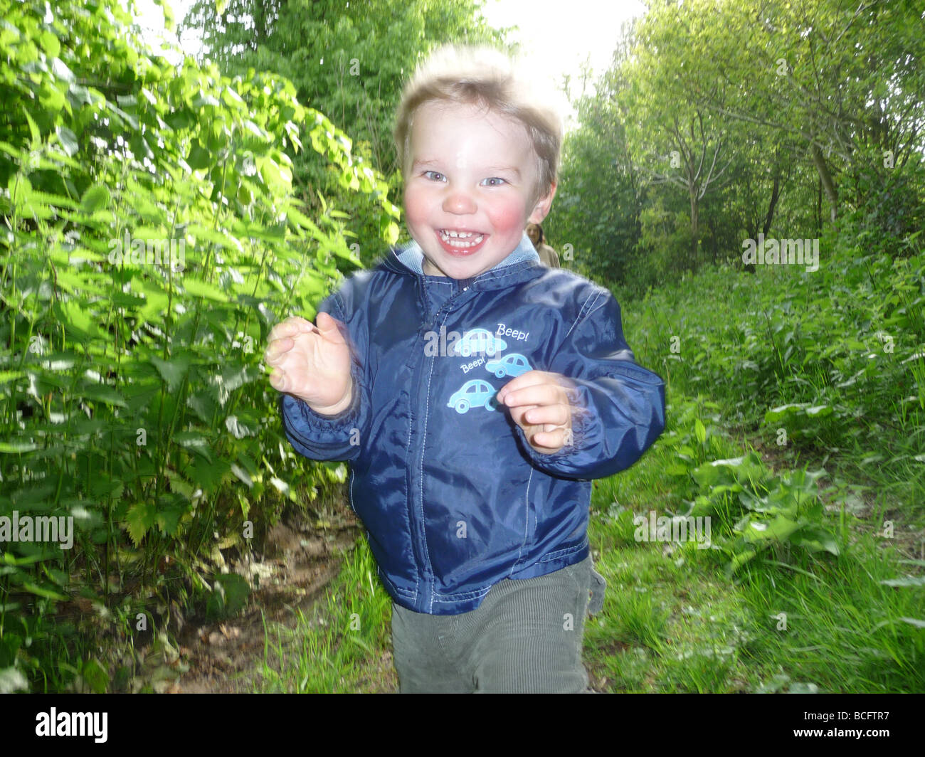 Young boy exploring the environment Stock Photo - Alamy