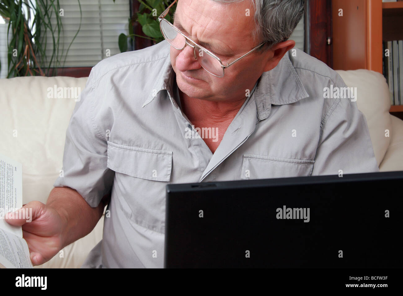 Person reading the computer manual hi-res stock photography and images ...