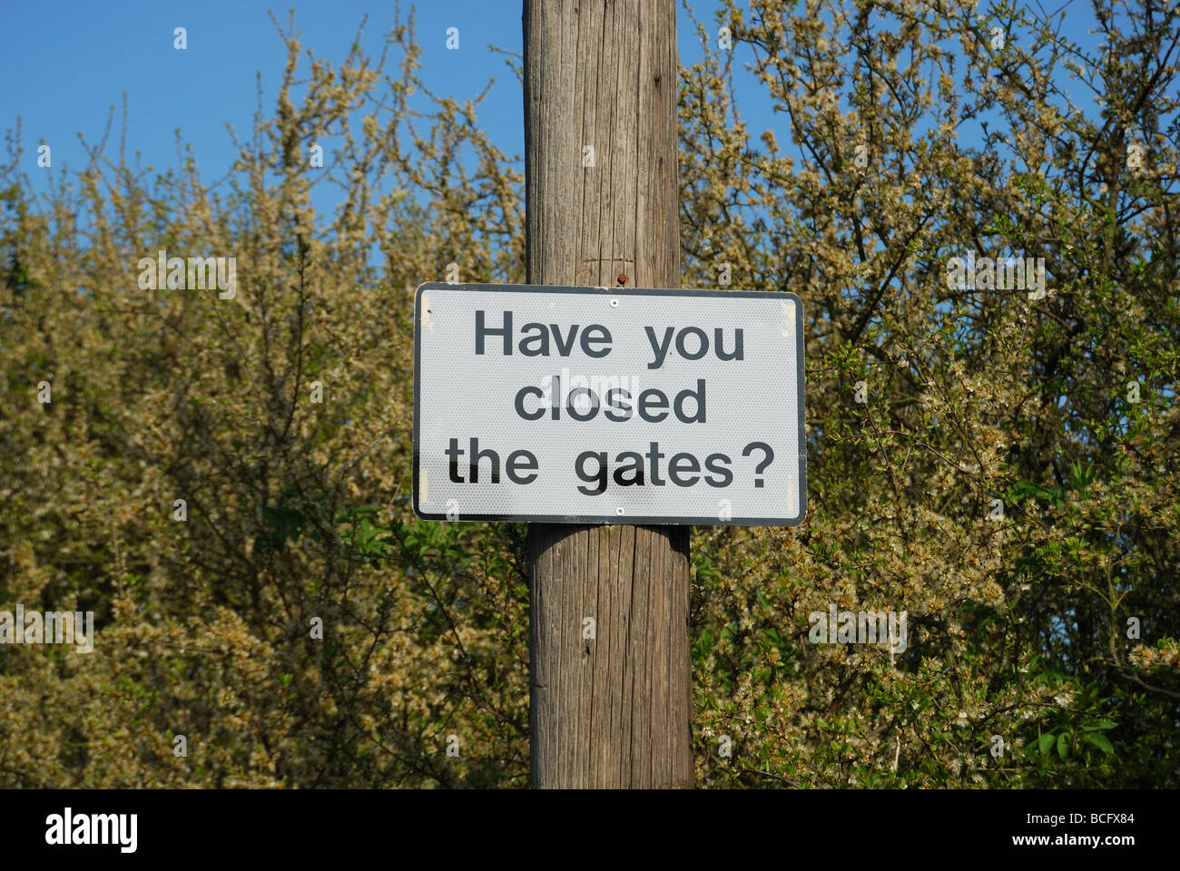 Sign attached to a post - "Have you closed the gates Stock Photo - Alamy