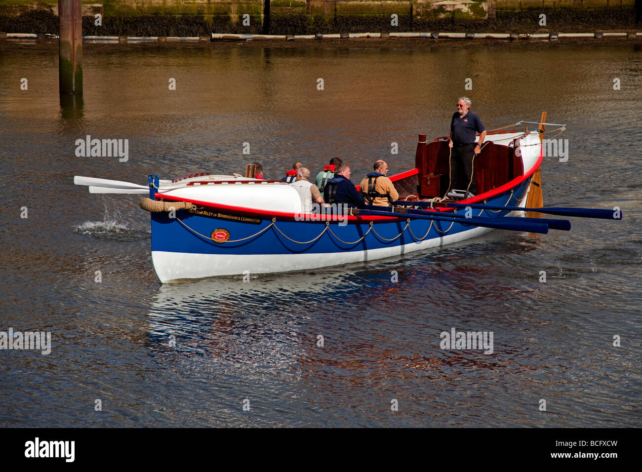 Six men rowing an old whitby lifeboat Stock Photo - Alamy