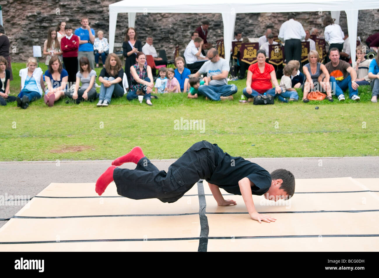 Boy break dancing at Skenfrith fun day. Street dancer entertaining the ...