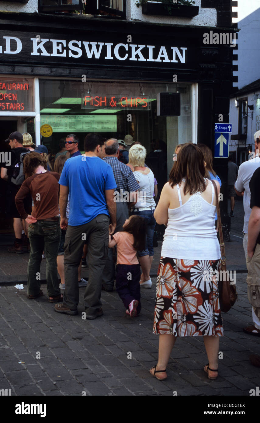 Line Of Customers Outside Busy Fish and Chip Shop In Keswick Stock ...