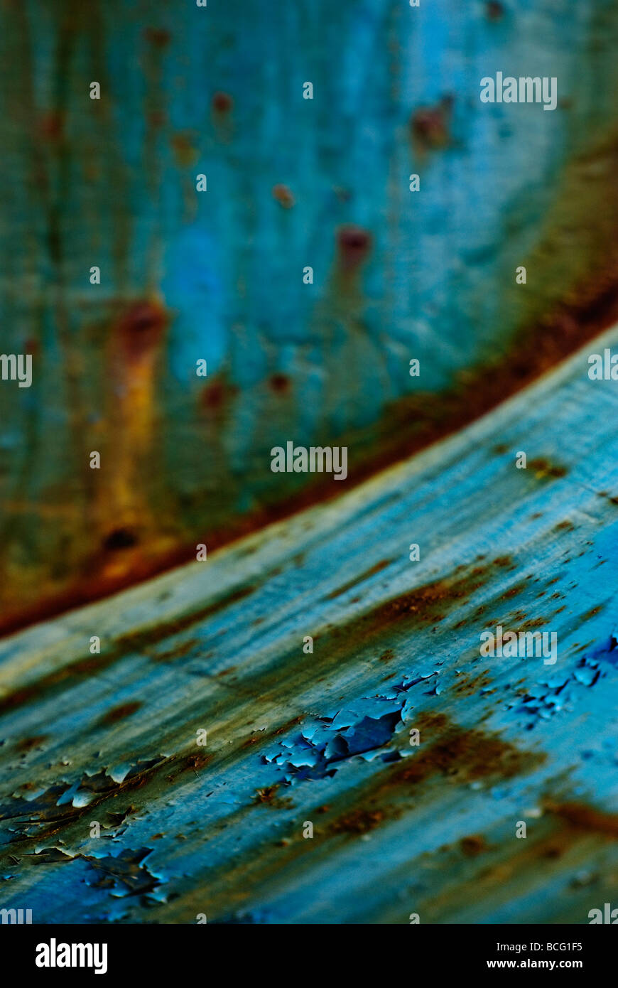 Peeling paint and rust on the hull of a fishing boat Cornwall England ...