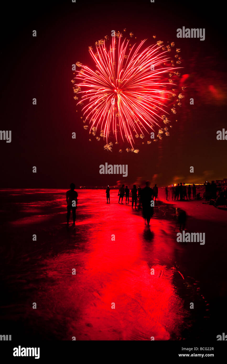 Fireworks explode along the beach at Isle of Palms SC marking ...