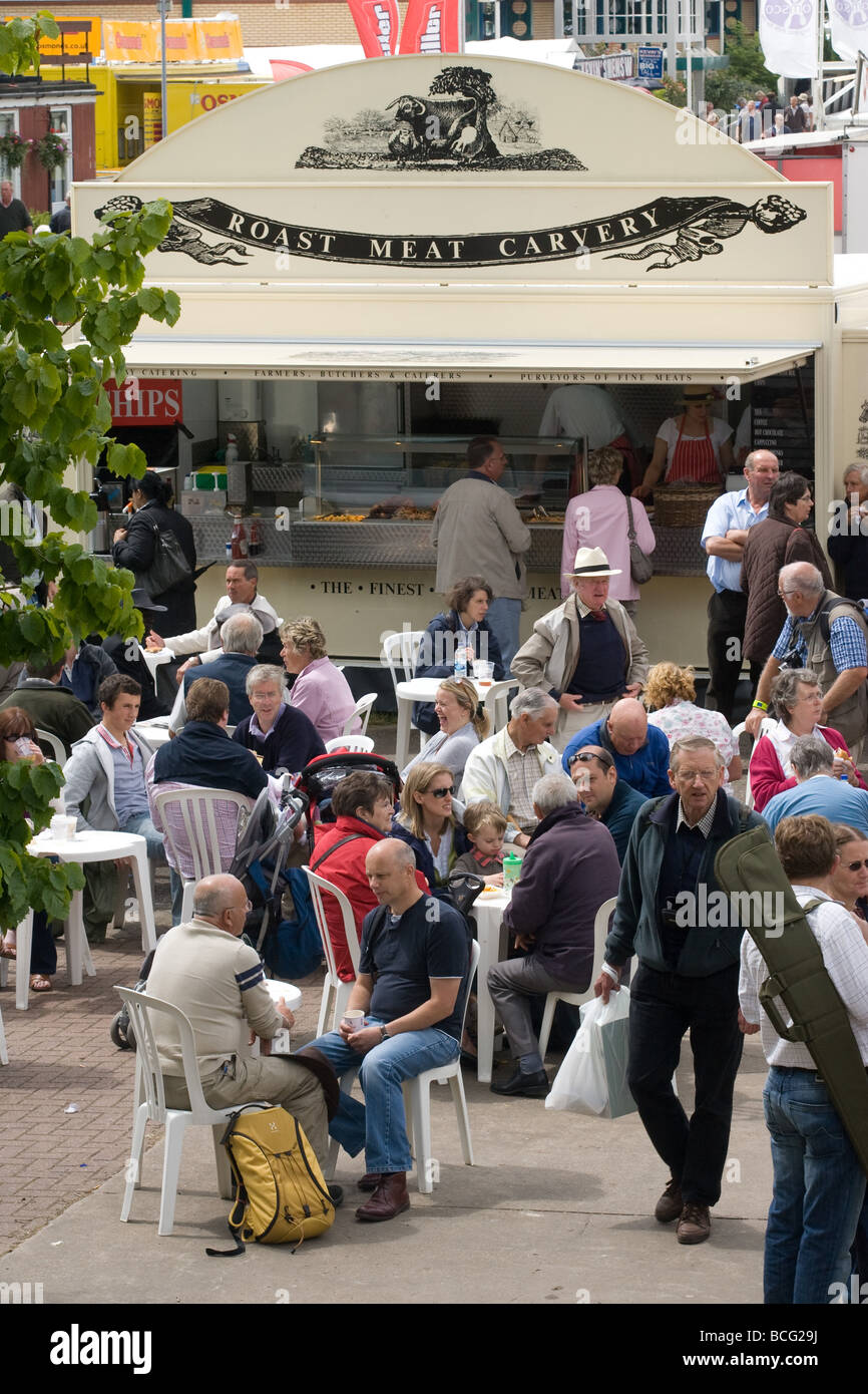 People Eating Outside Of A Mobile Catering Unit Stock Photo - Alamy
