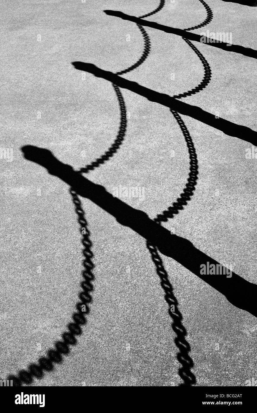 Abstract shadow of chain link fence on concrete Stock Photo - Alamy