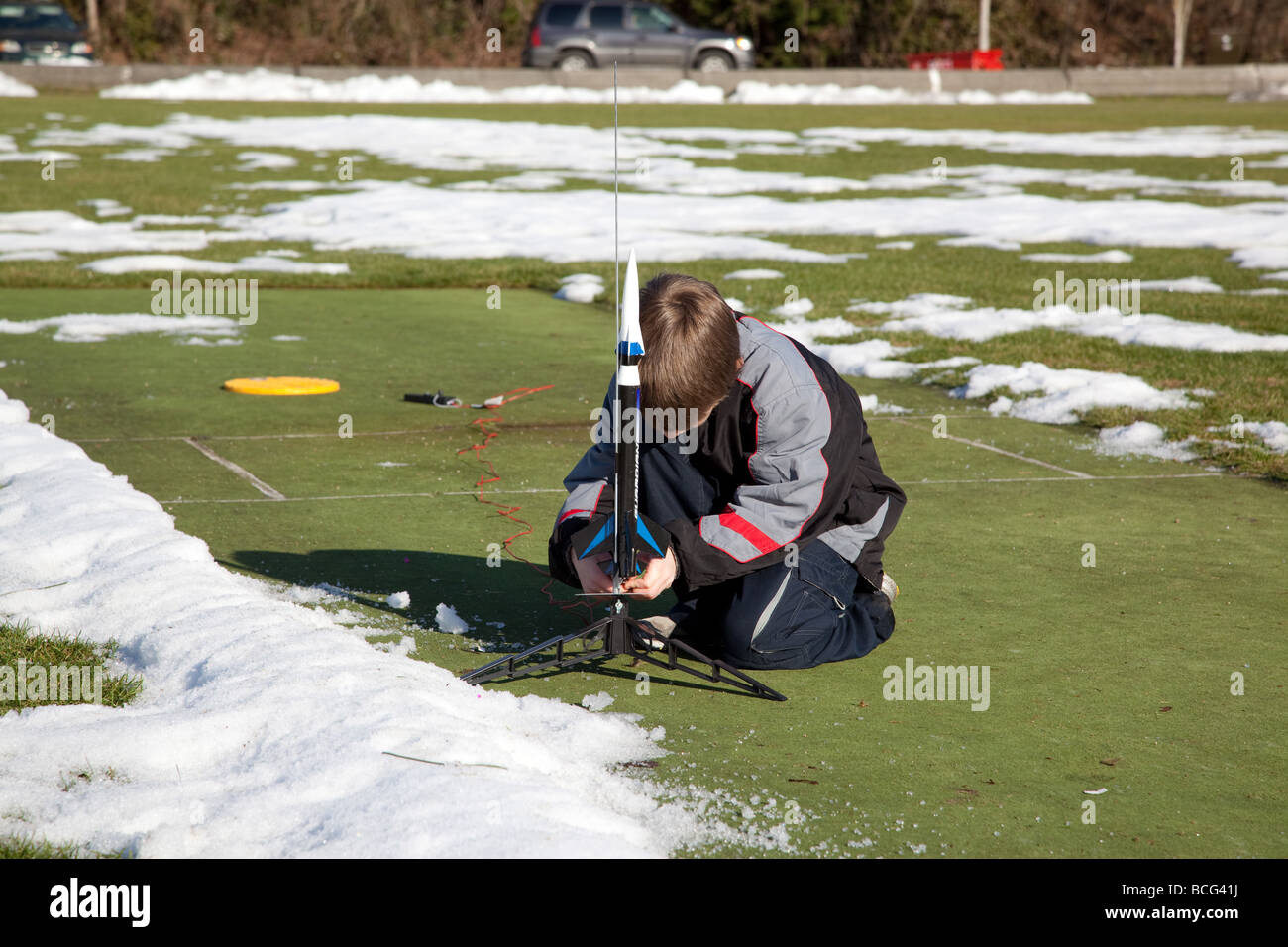 Young boy getting ready to fire of a rocket Stock Photo - Alamy