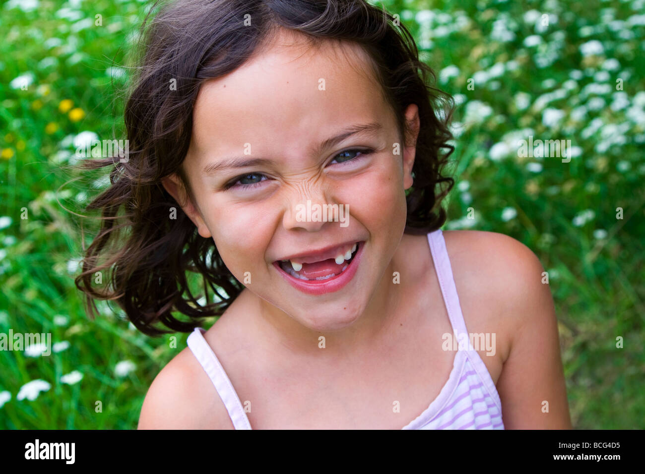 Summer portrait of young girl smiling missing front teeth Stock Photo ...