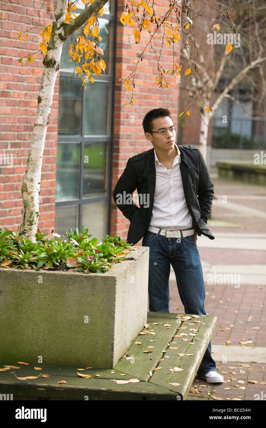 Young Asian man outside in fall weather Stock Photo - Alamy