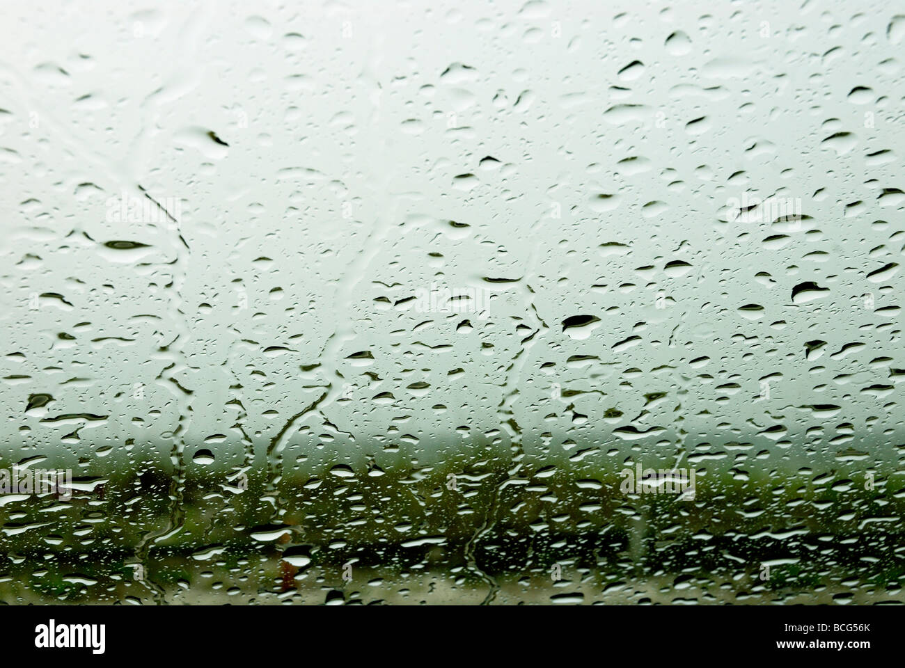 Raindrops through a car window Stock Photo - Alamy