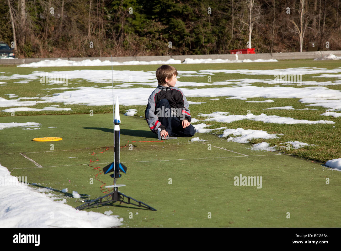 Young boy getting ready to fire of a rocket Stock Photo - Alamy