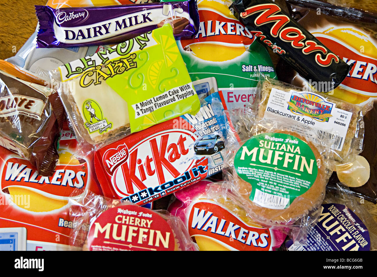 a selection of snacks like crisps and chocolate on sale at a small ...