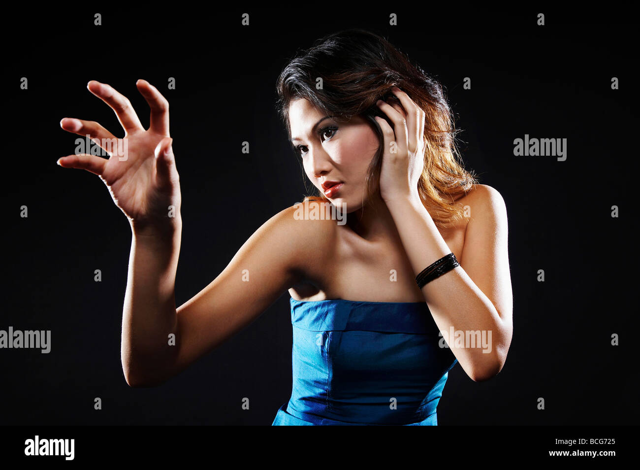 woman is turning an invisible button Stock Photo - Alamy