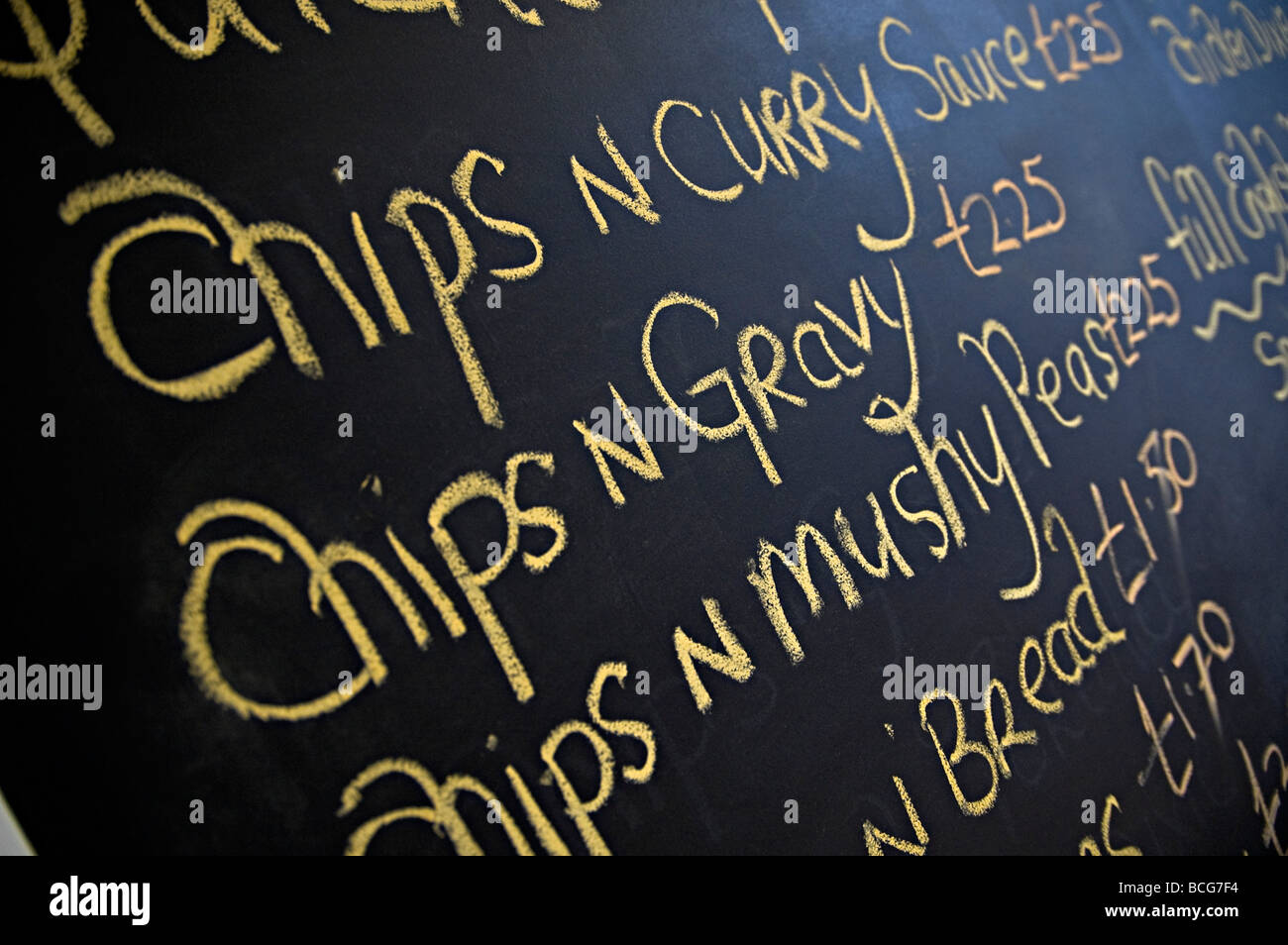 chips written on a blackboard with it written with chalk on a menu for ...
