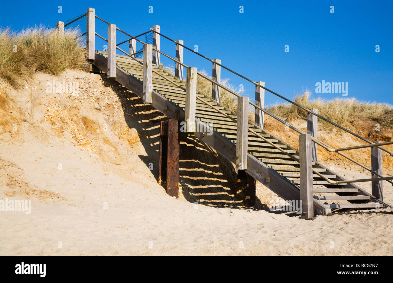 Wooden steps leading to a sandy beach hi-res stock photography and ...