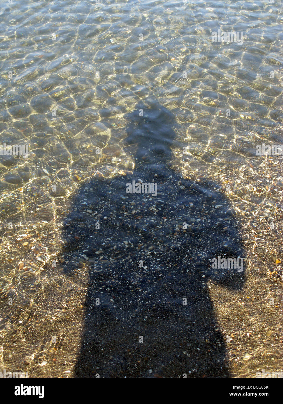 person's shadow in lake water surface Stock Photo - Alamy