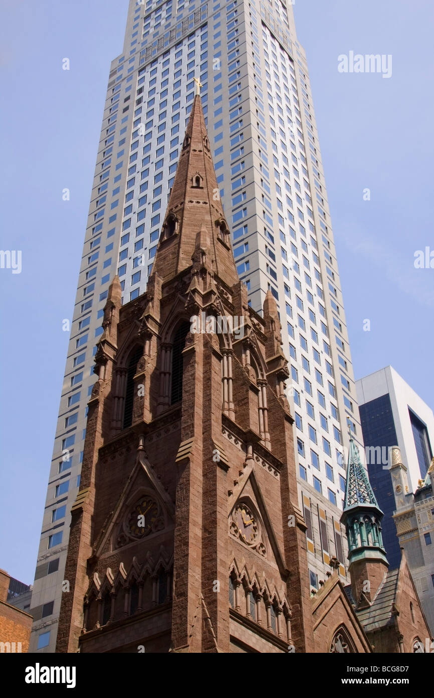 Contrast of the old church against a modern skyscraper in New York, USA ...
