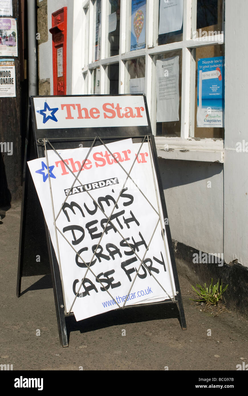 Newspaper headline board outside a newsagents shop in England Stock ...
