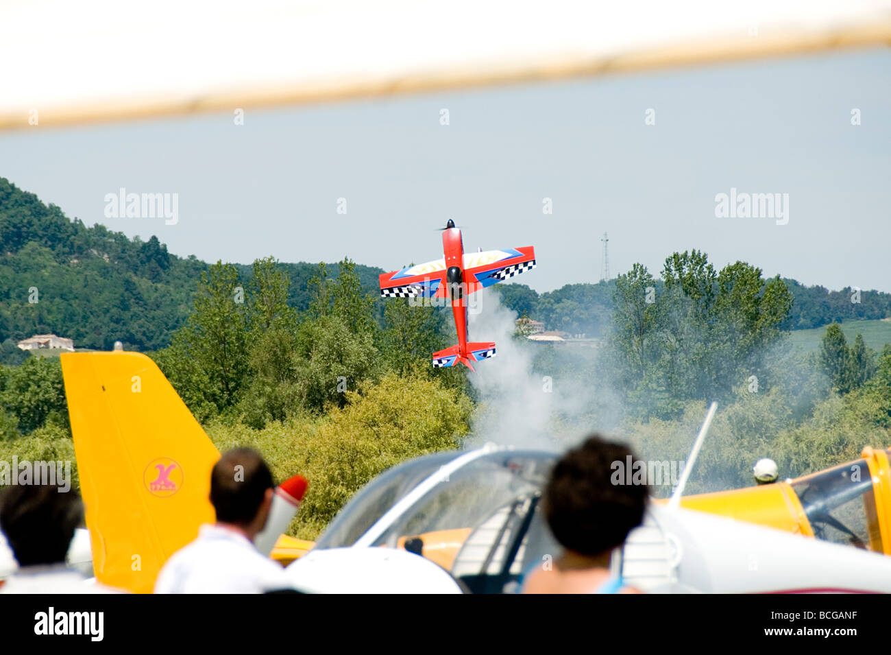 Model aircraft giving an acrobatics demonstration at an airshow in ...