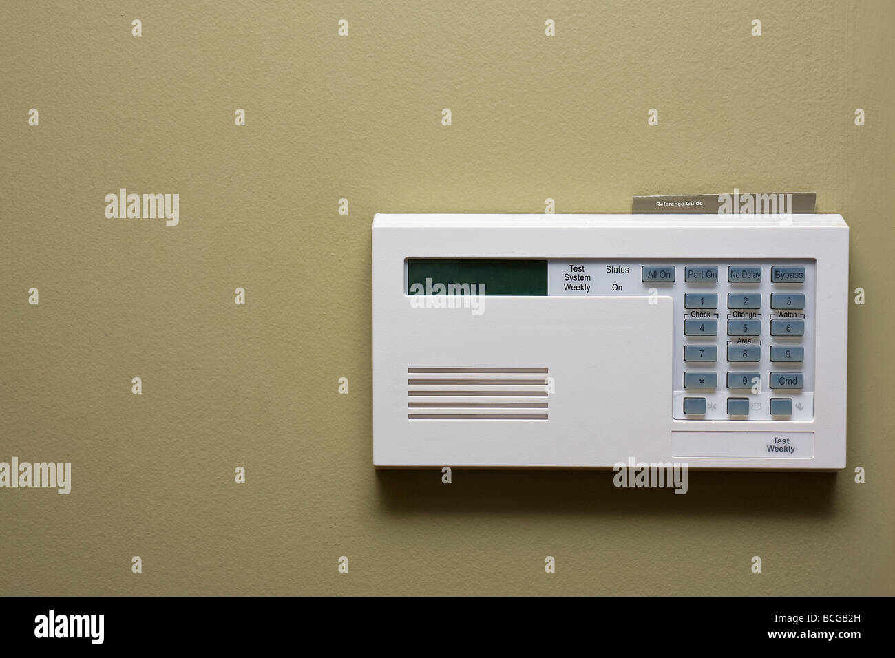 home security control panel on green wall Stock Photo - Alamy