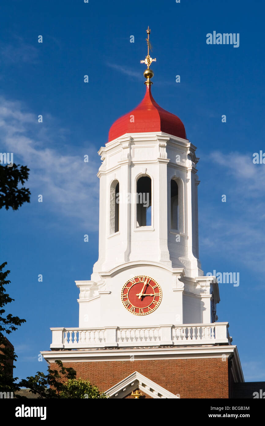 Close up of red cupola dome with gold weather vane on clock tower ...