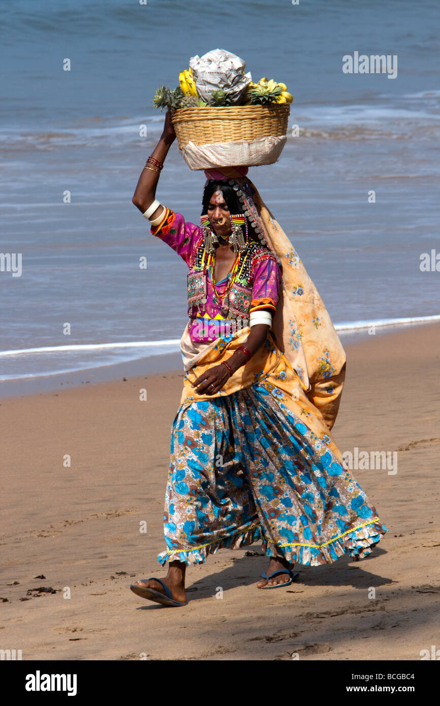 Woman beach fruit seller Anjuna weekly hippy flea market Goa India ...