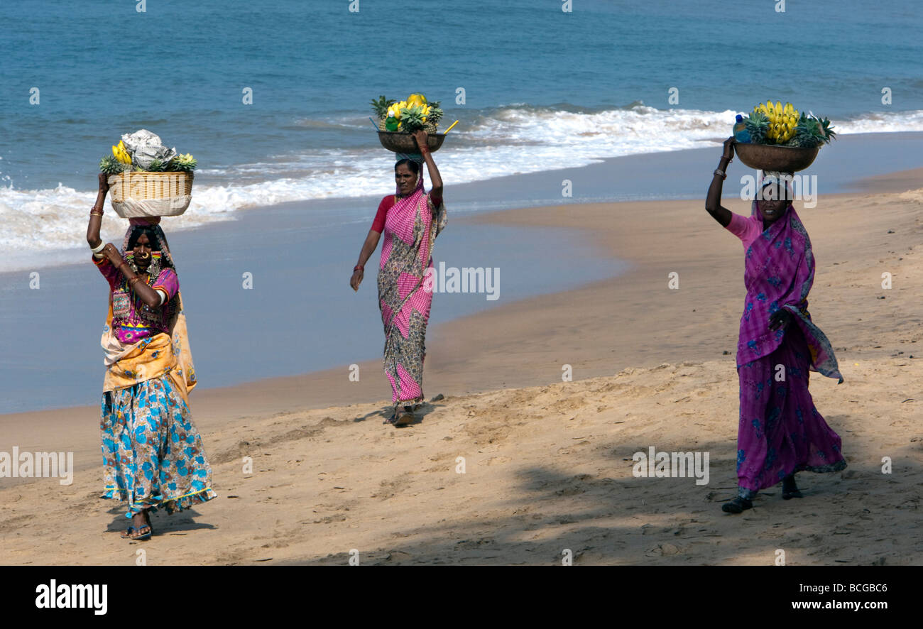 Women beach fruit sellers Anjuna weekly hippy flea market Goa India ...