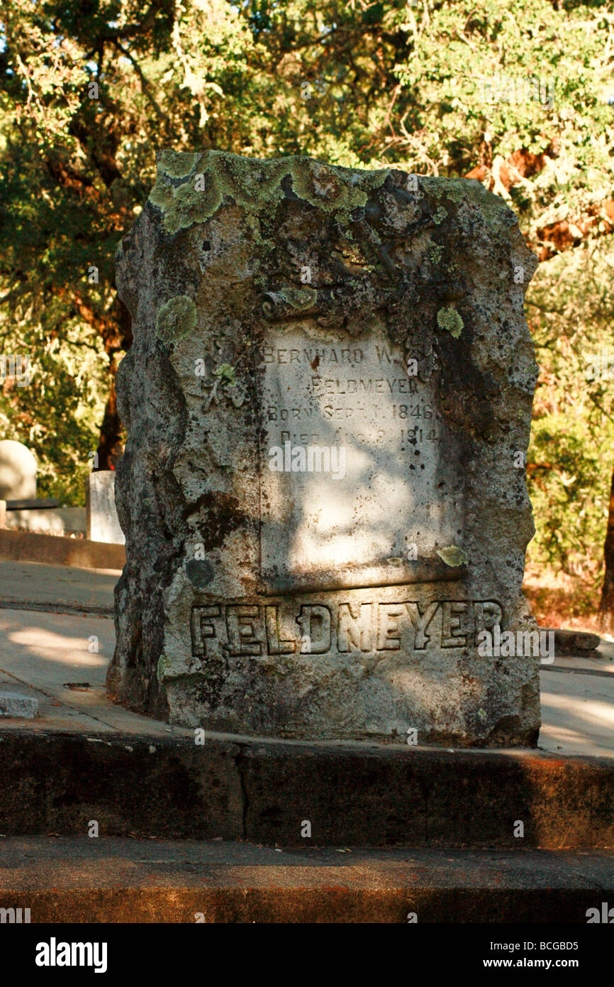 aged tombstone in rustic cemetery Stock Photo - Alamy