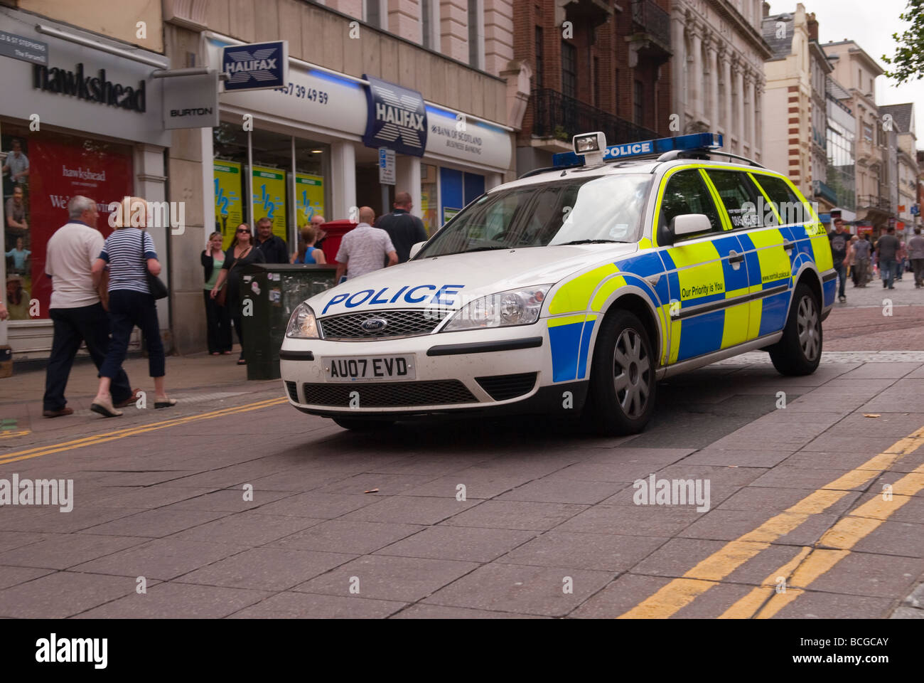 Cars policeman policing city town uk hi-res stock photography and ...