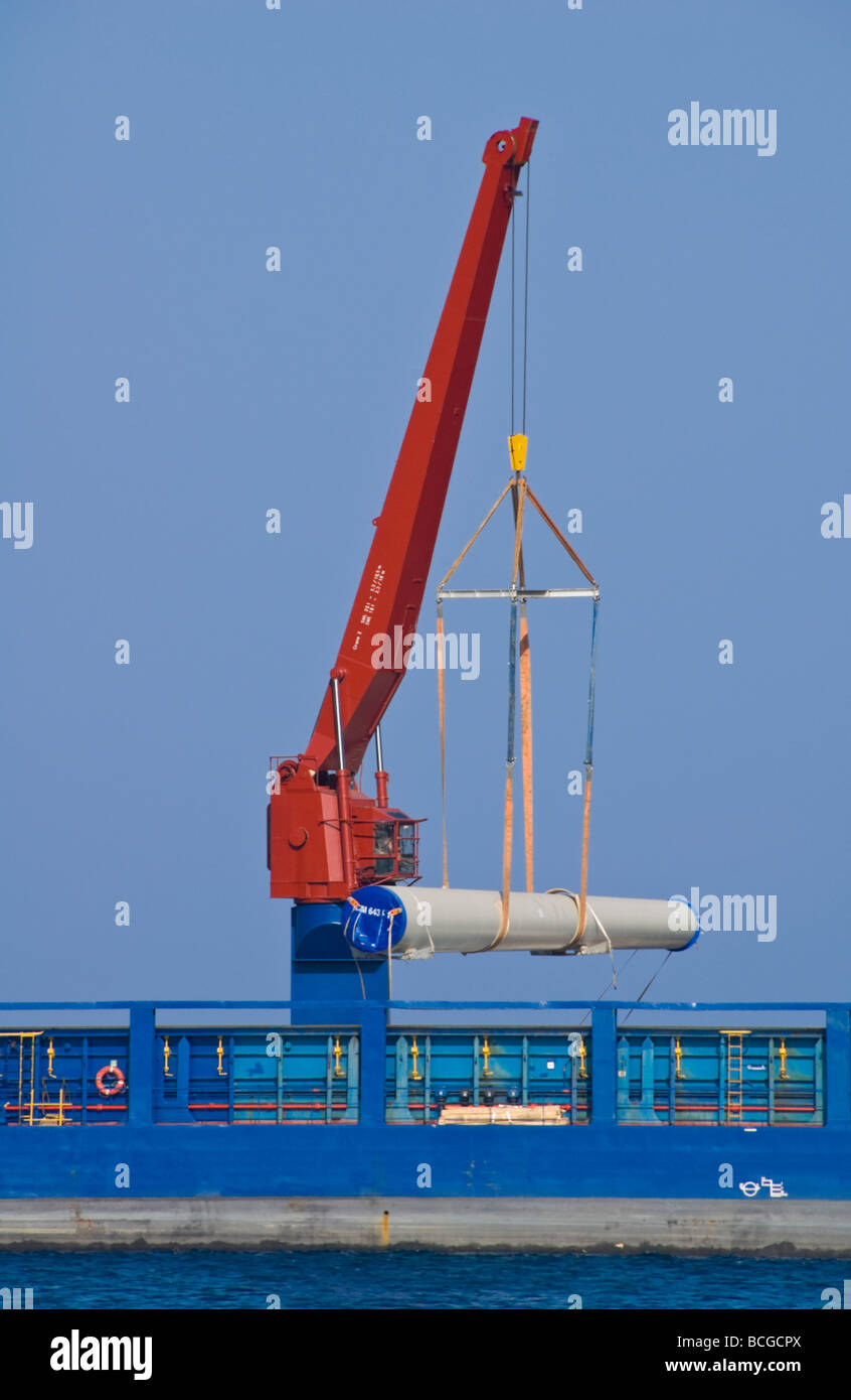Heavy load of wind turbine mast being unloaded from cargo ship at Agia ...