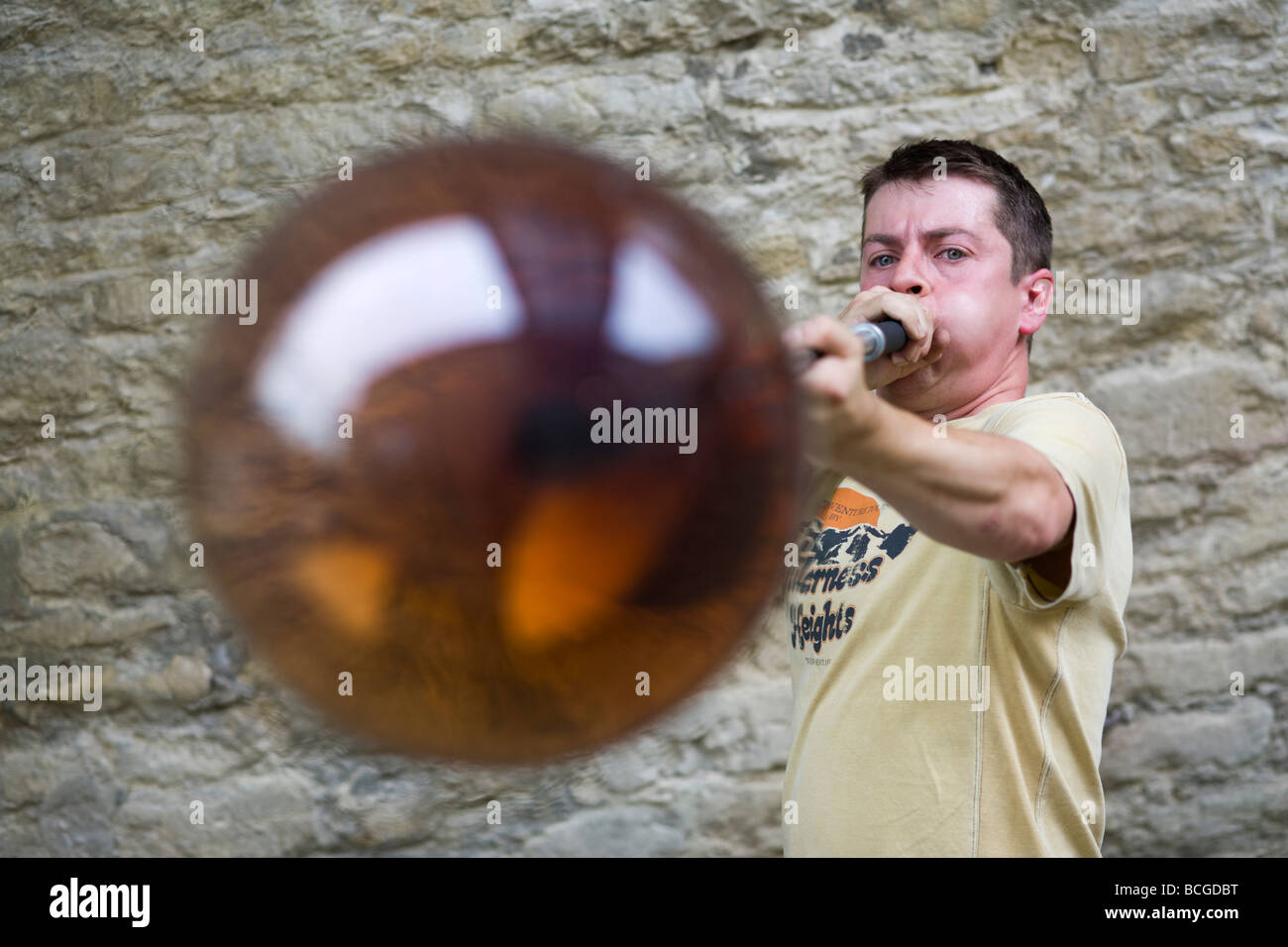 Colin Hawkins, glass blower at the Loco glass studio creating blown ...