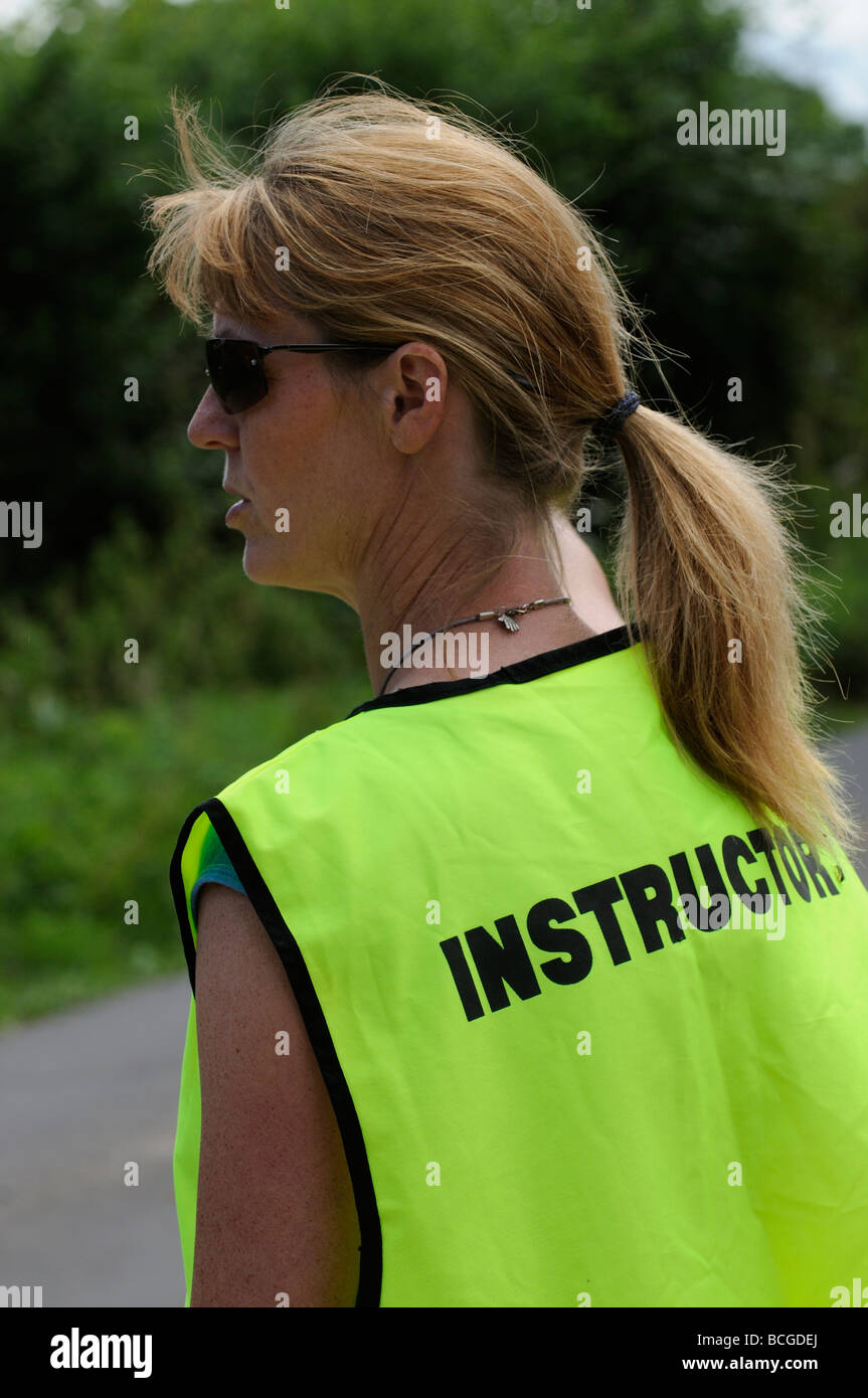 Female instructor wearing a high visibility reflective safety jacket ...