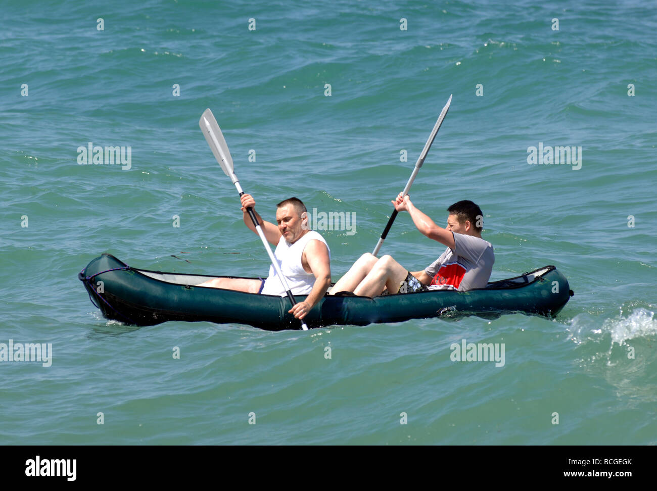 Two men in a boat Stock Photo - Alamy