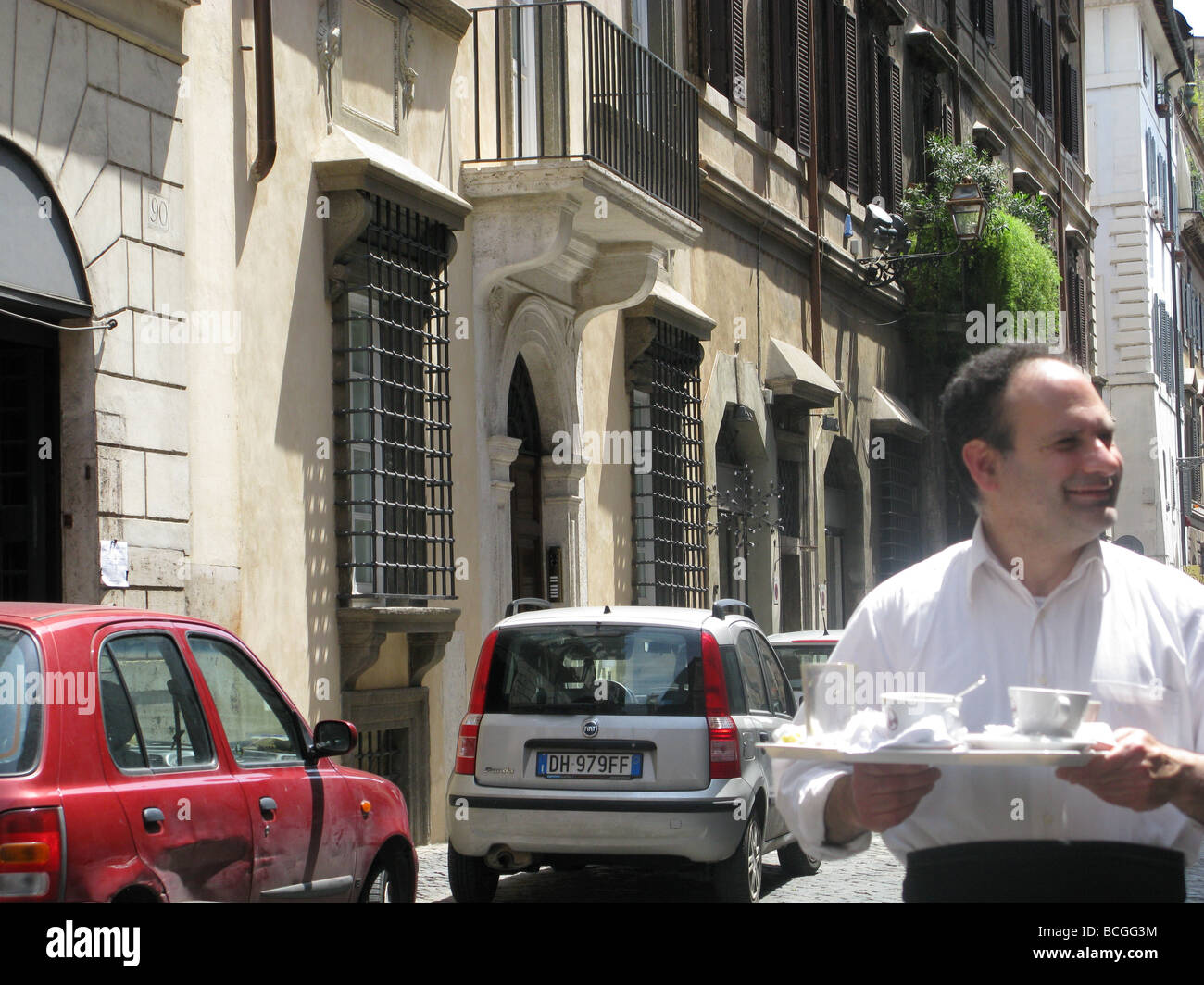 waiter delivering coffee on via giulia street in rome, italy Stock ...