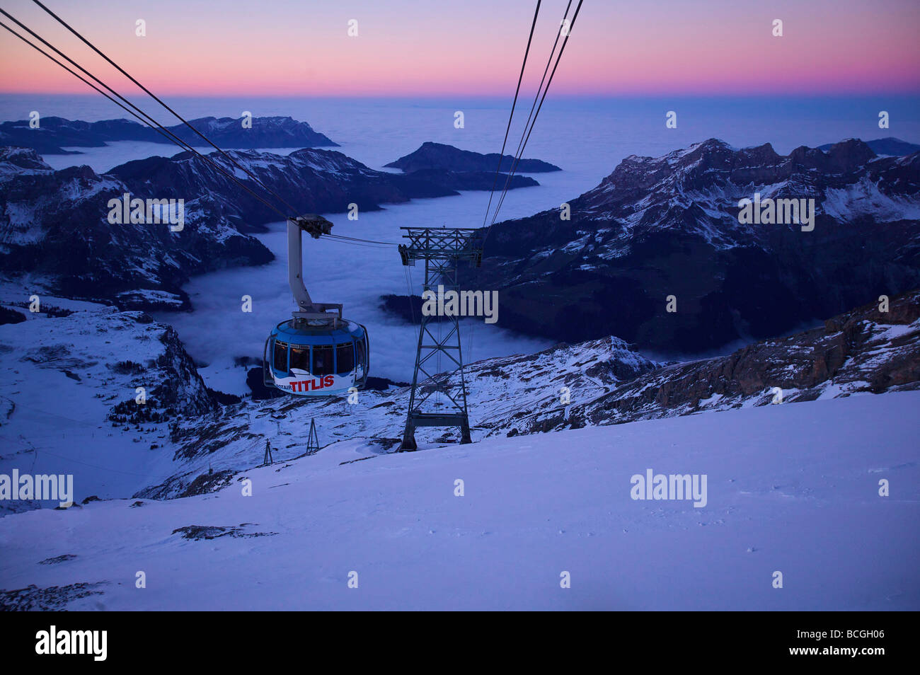 View of the Titlis cable car at sunset over the Titlas Glacier ...