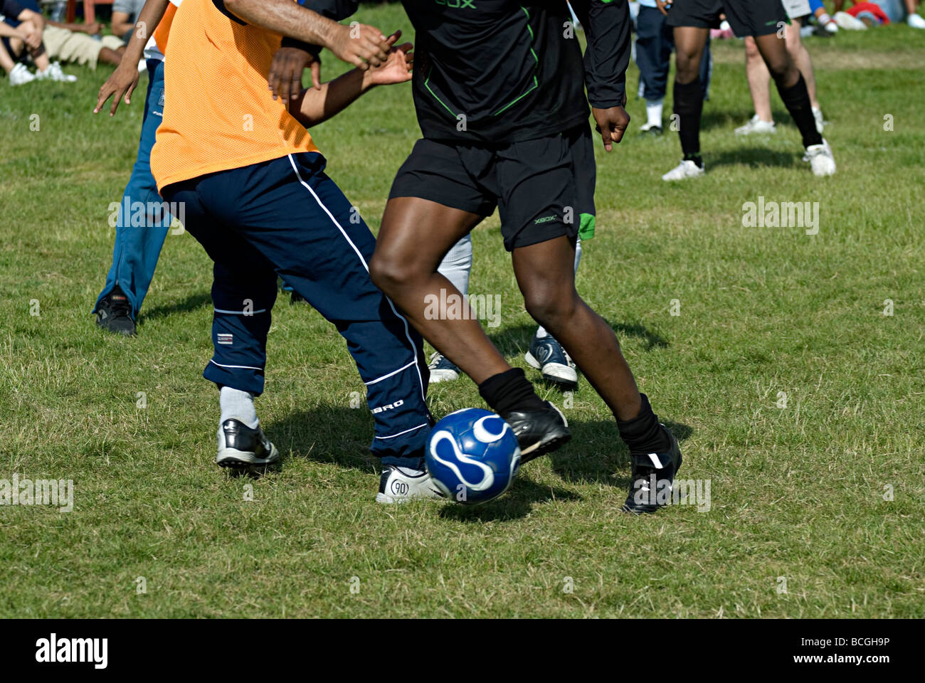young black men tackling each other playing at a 5 a side tournament at ...