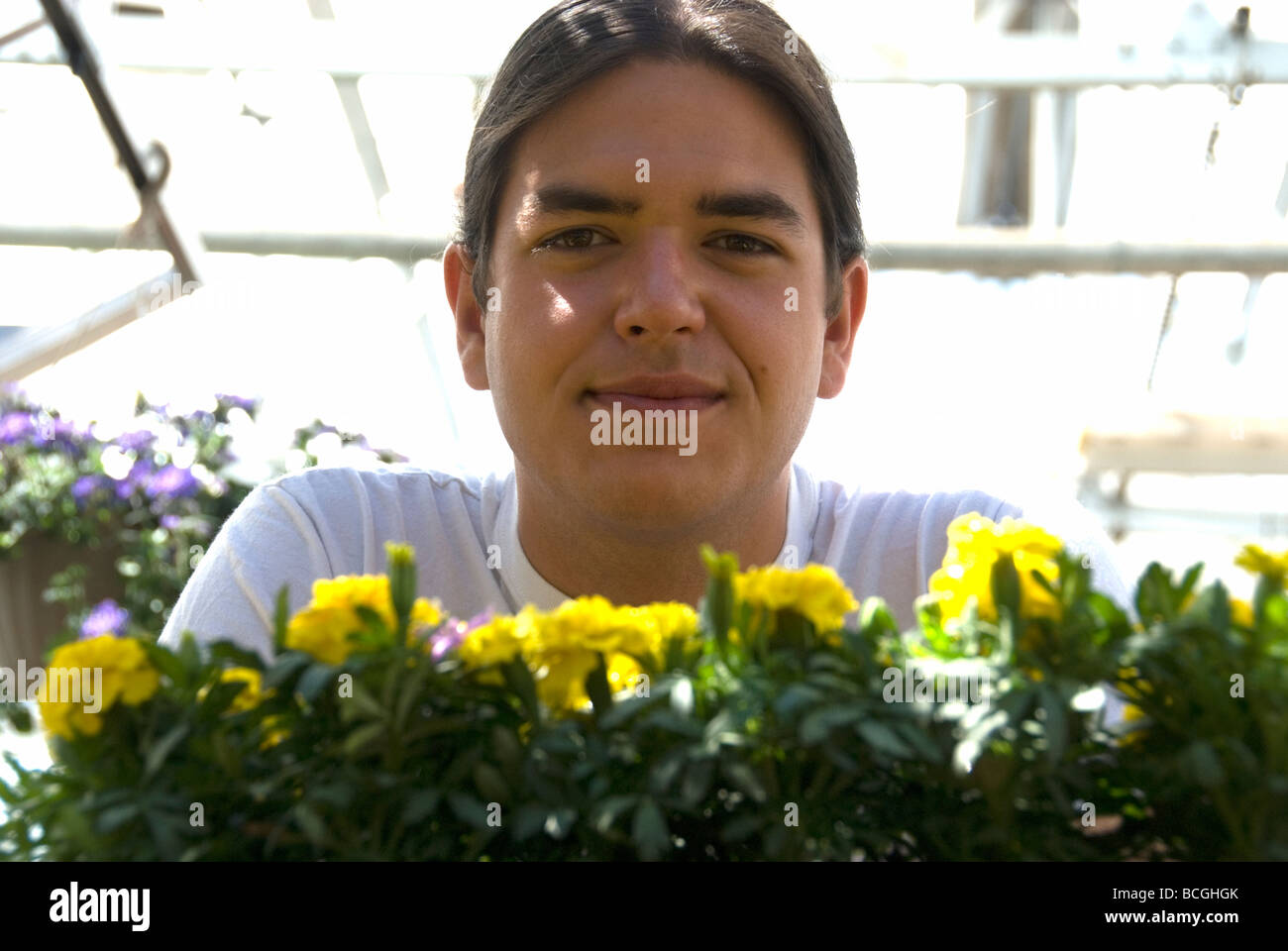 Ethnic family planting flowers hi-res stock photography and images - Alamy