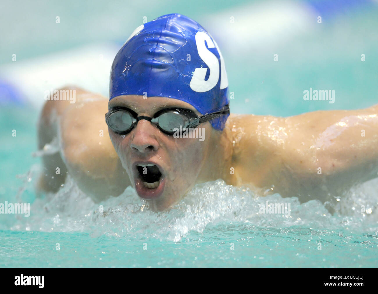 Swimmer competing, butterfly stroke Stock Photo - Alamy
