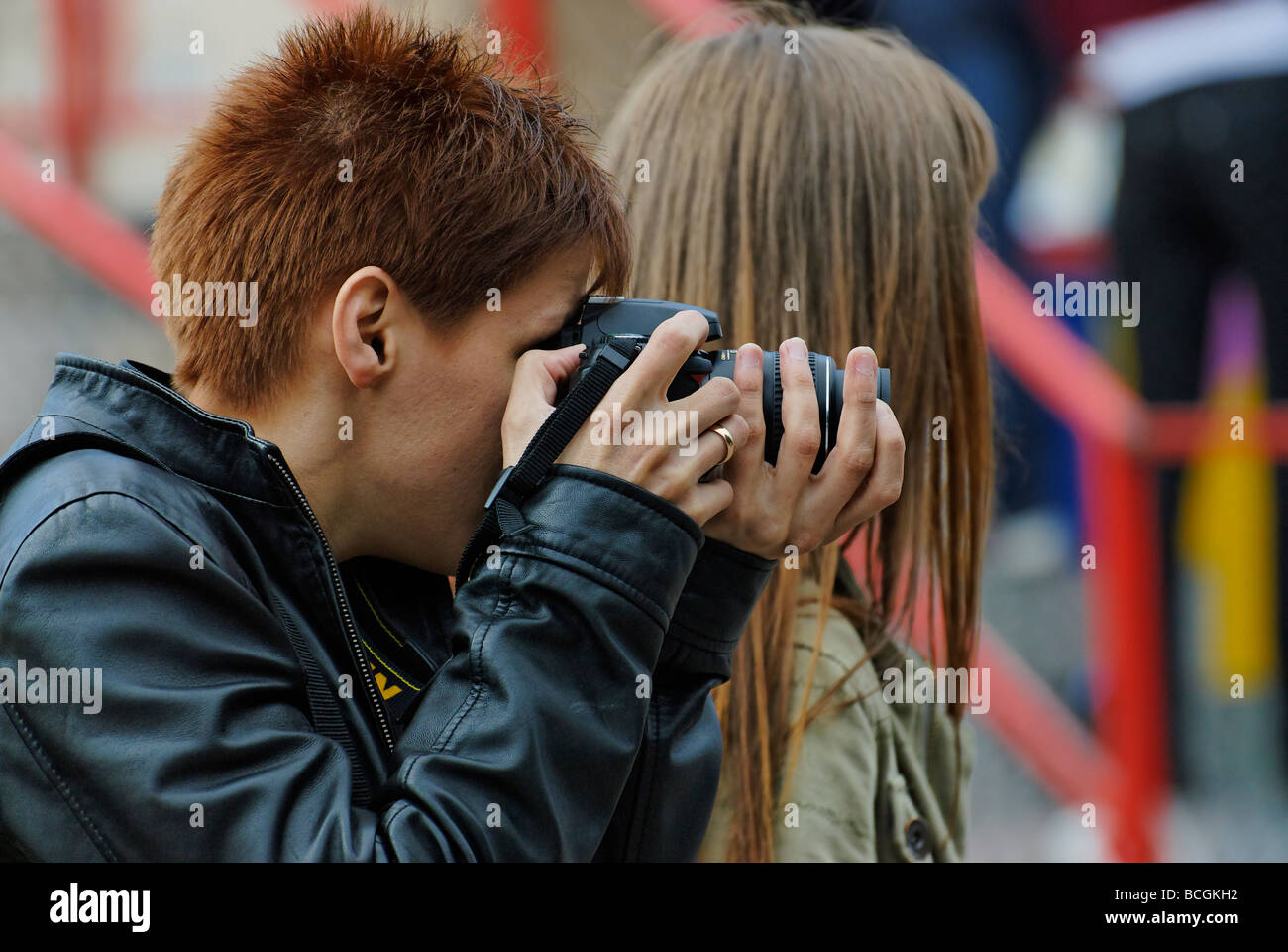Woman photographer tries to take an interesting photo Stock Photo - Alamy