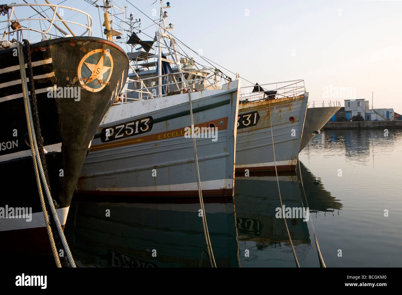 Fishing boats in harbour Stock Photo - Alamy