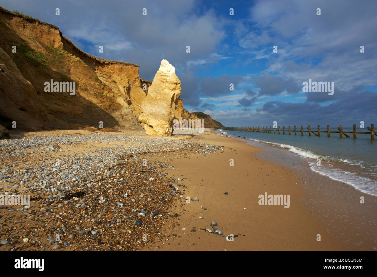 Sunlight hits the cliffs and the distinctive sea stack at West Runton ...