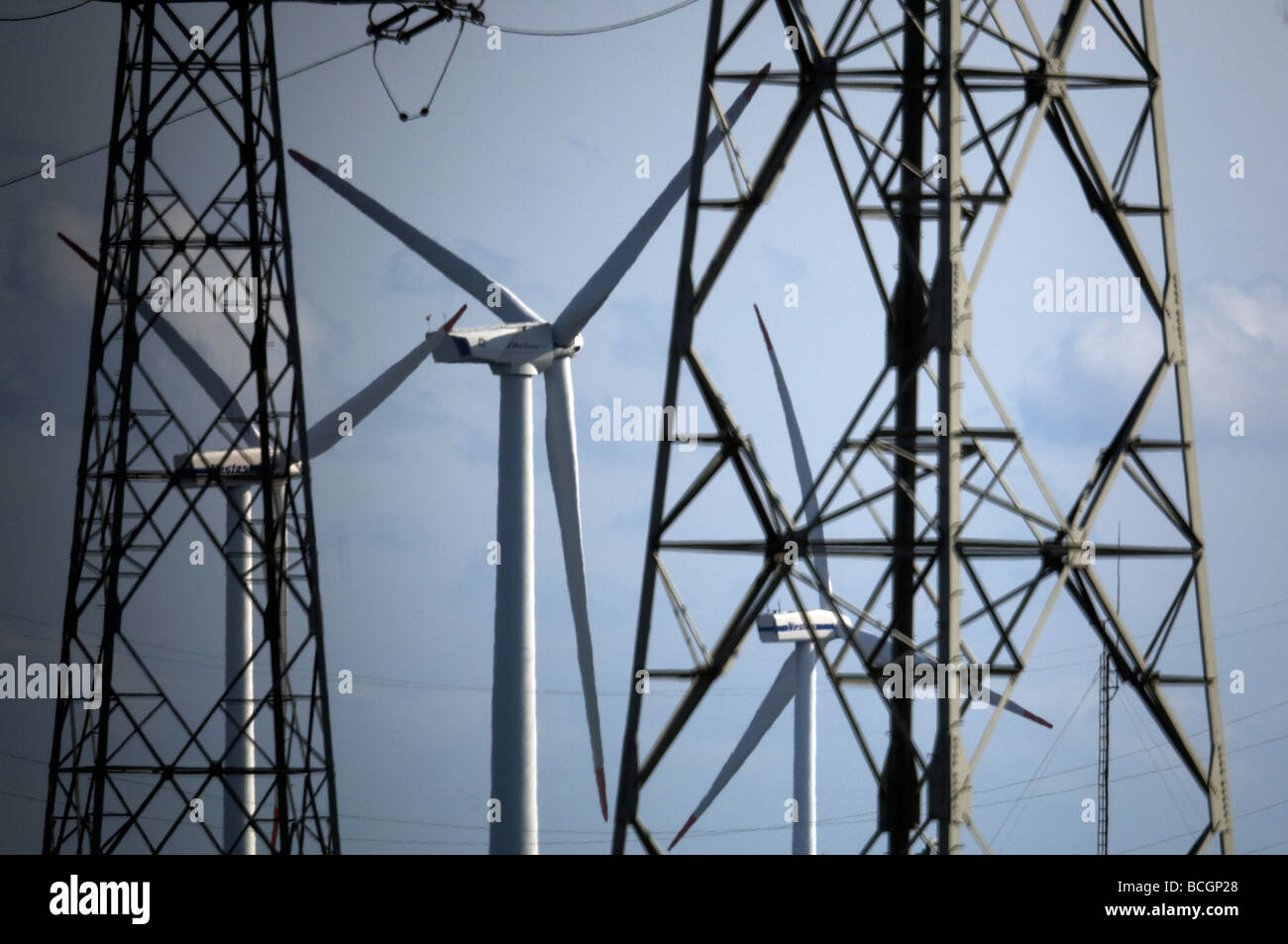 wind turbines and electricity pylons at a power station owned by Total ...