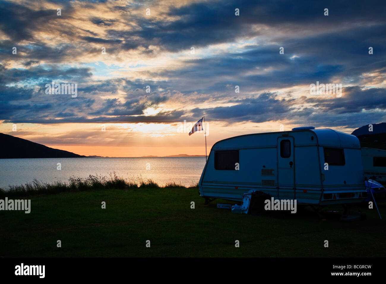 Camper vans on a campsite at sunset, Ullapool, Loch Broom, Highlands ...